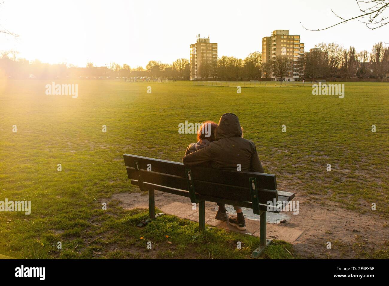 Boy sitting bench rear view hi-res stock photography and images - Alamy