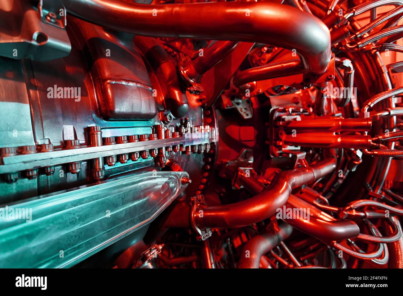 A modern gas turbine aircraft engine in a futuristic red-green light ...
