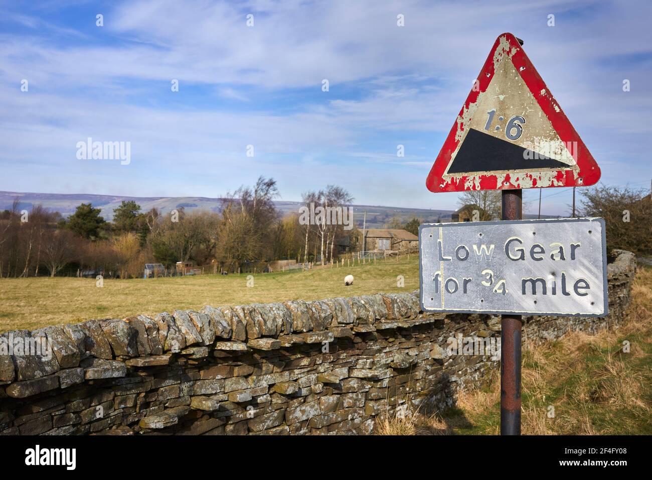 Weathered roadside warning sign for steep hill Stock Photo - Alamy