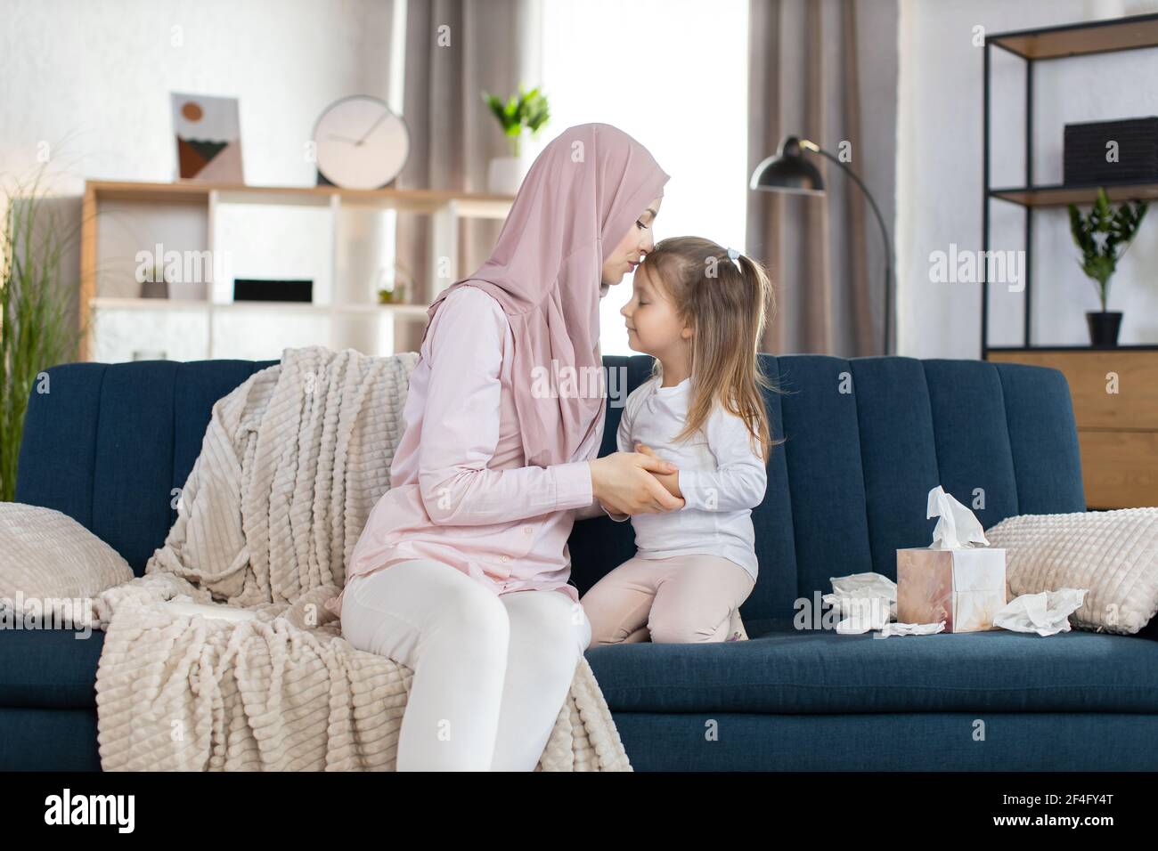 Lovely family mom and child. Happy affectionate young Muslim mother in ...