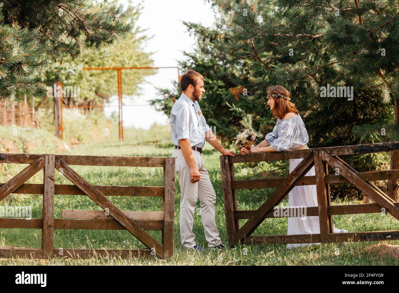 Eclectic rustic wedding couple. Intimate ceremony at backyard Stock ...