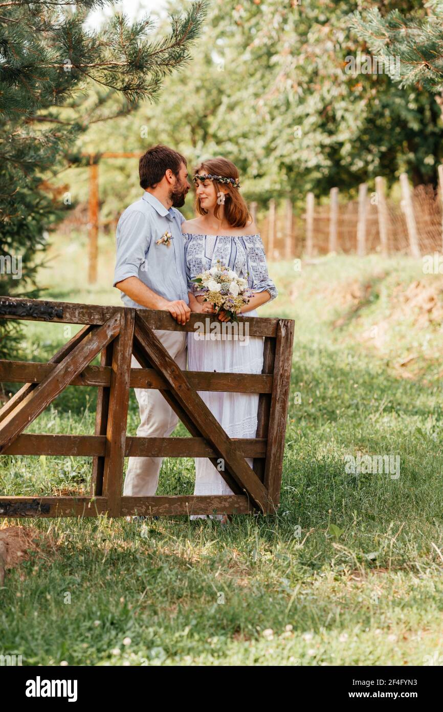 Eclectic rustic wedding couple. Intimate ceremony at backyard Stock ...
