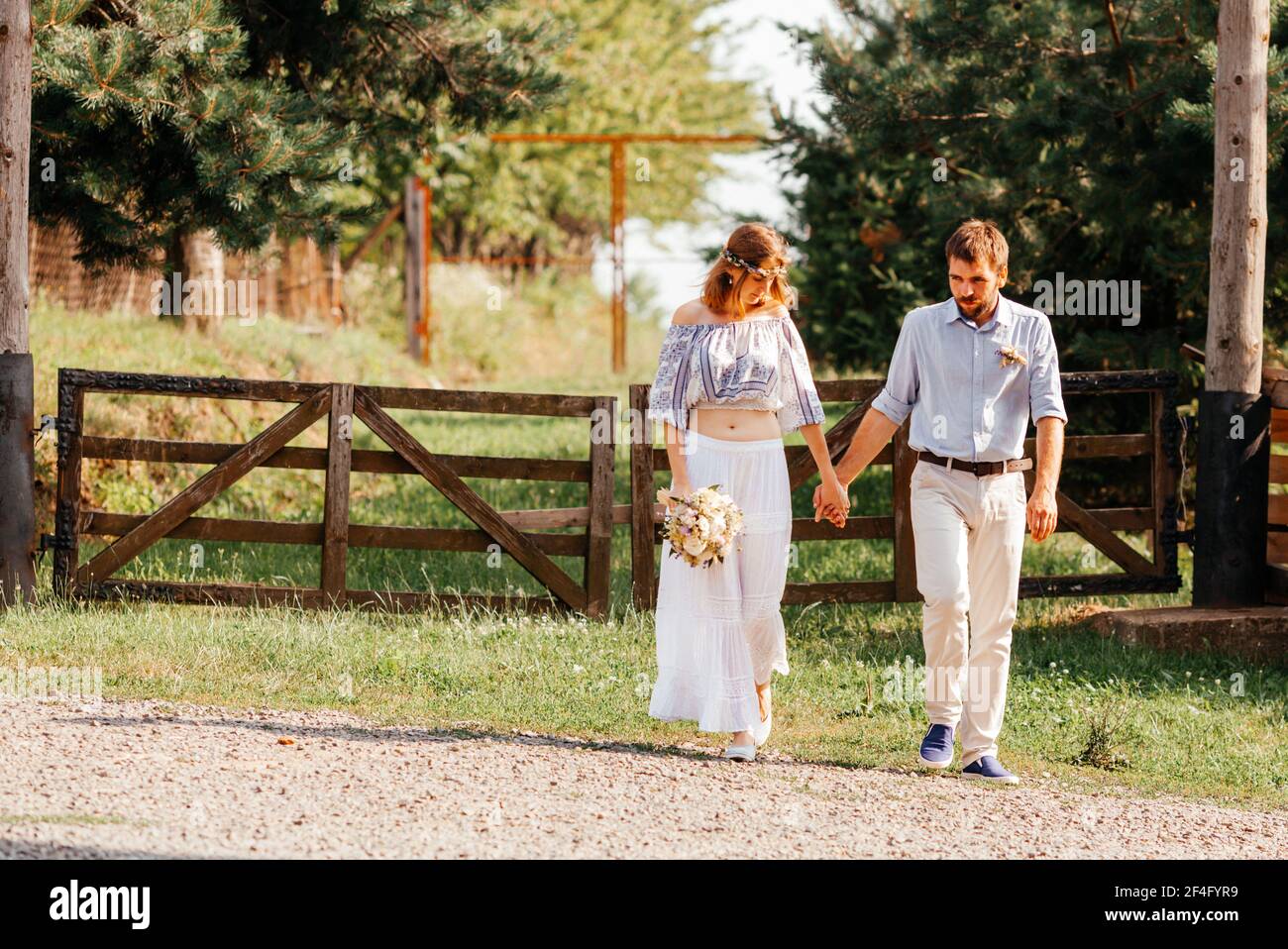 Eclectic rustic wedding couple. Intimate ceremony at backyard Stock ...