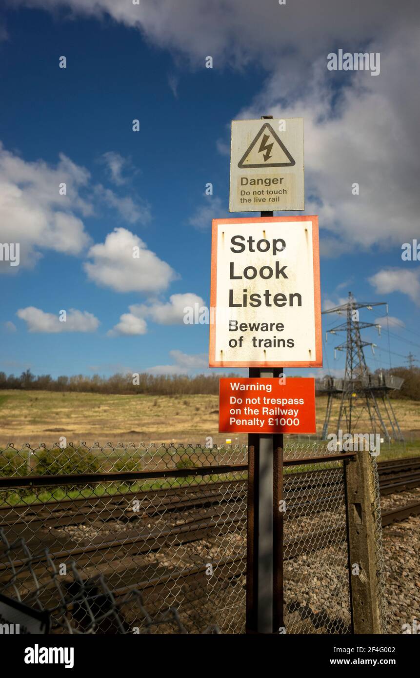 Portrait image of signage by train tracks in Sturry, Kent, displaying ...