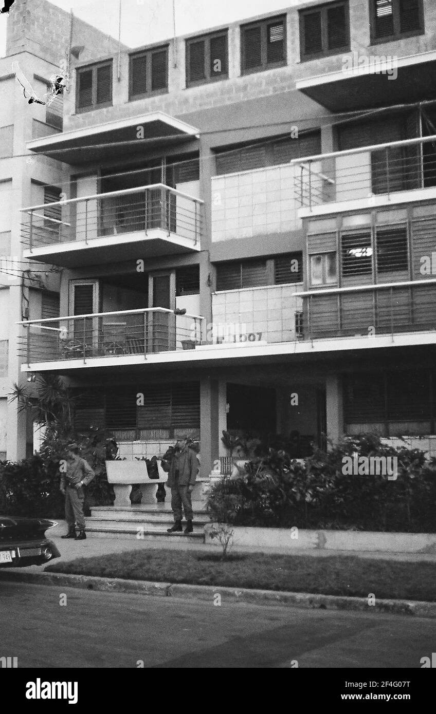 Facade with two men likely standing guard at Fidel Castro's building ...