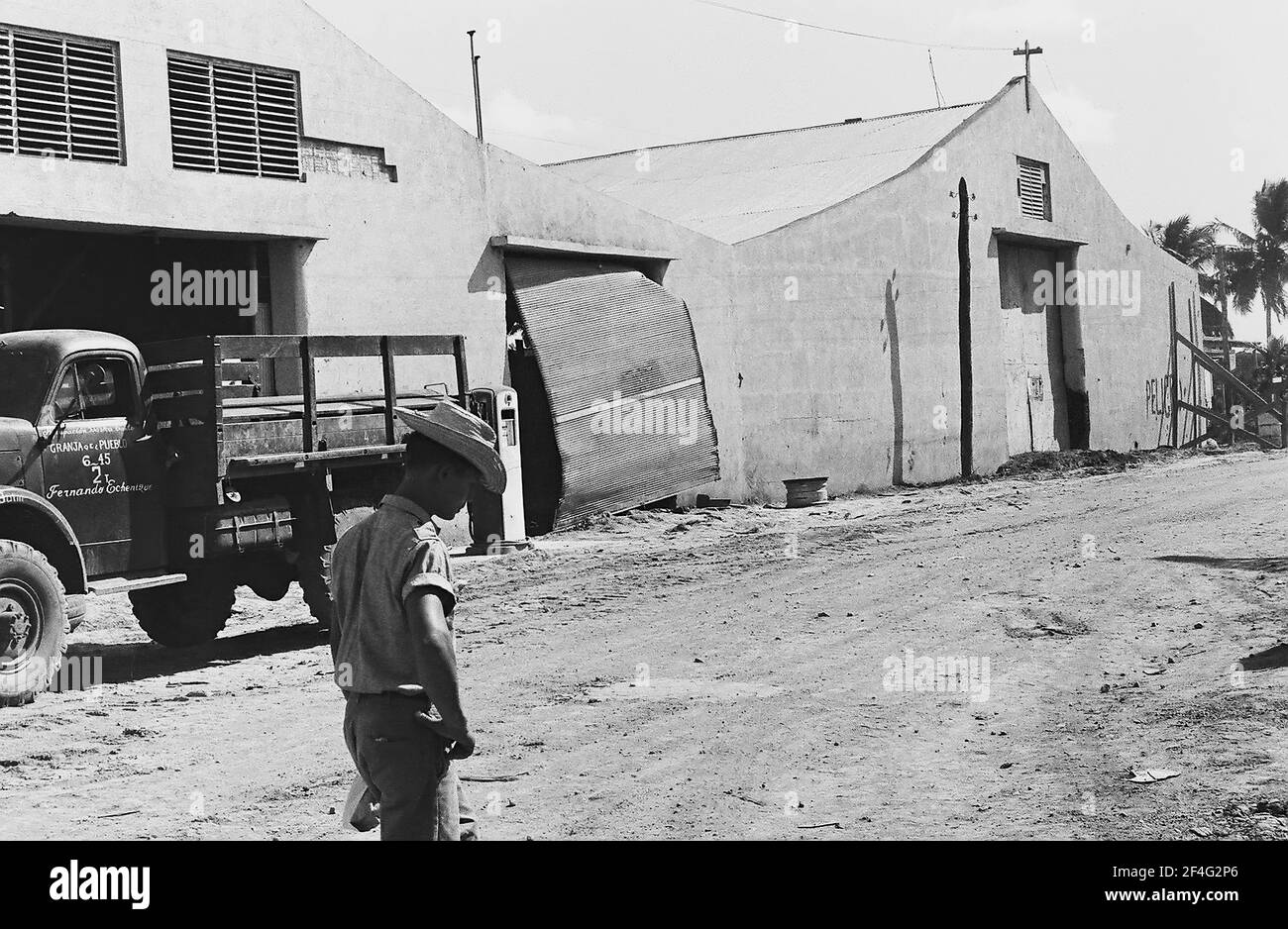 Hurricane Flora damage, central Cuba, with man standing near road and ...