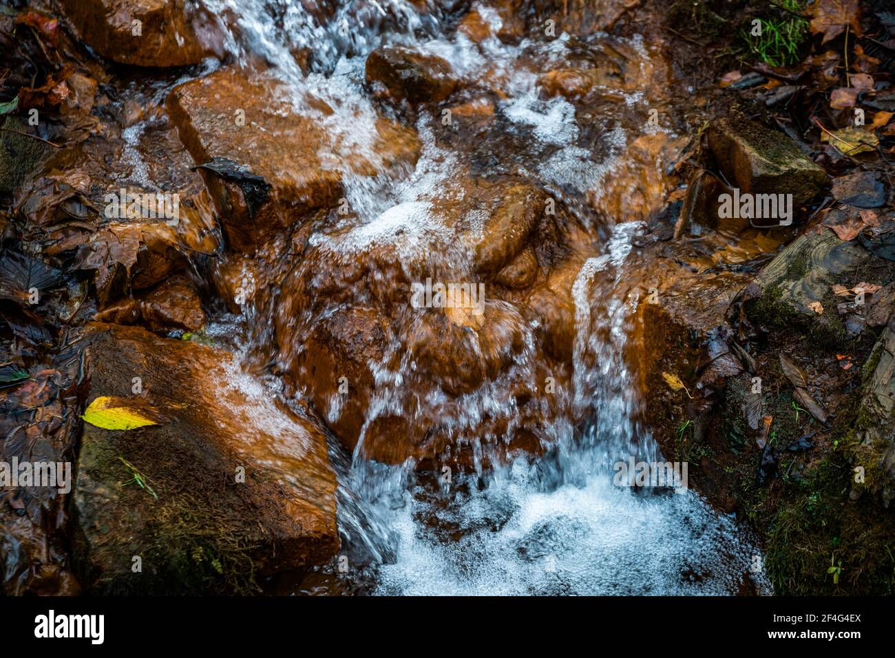 Waterfalls of Ieriku nature park at old watermill in the forest. It's a ...