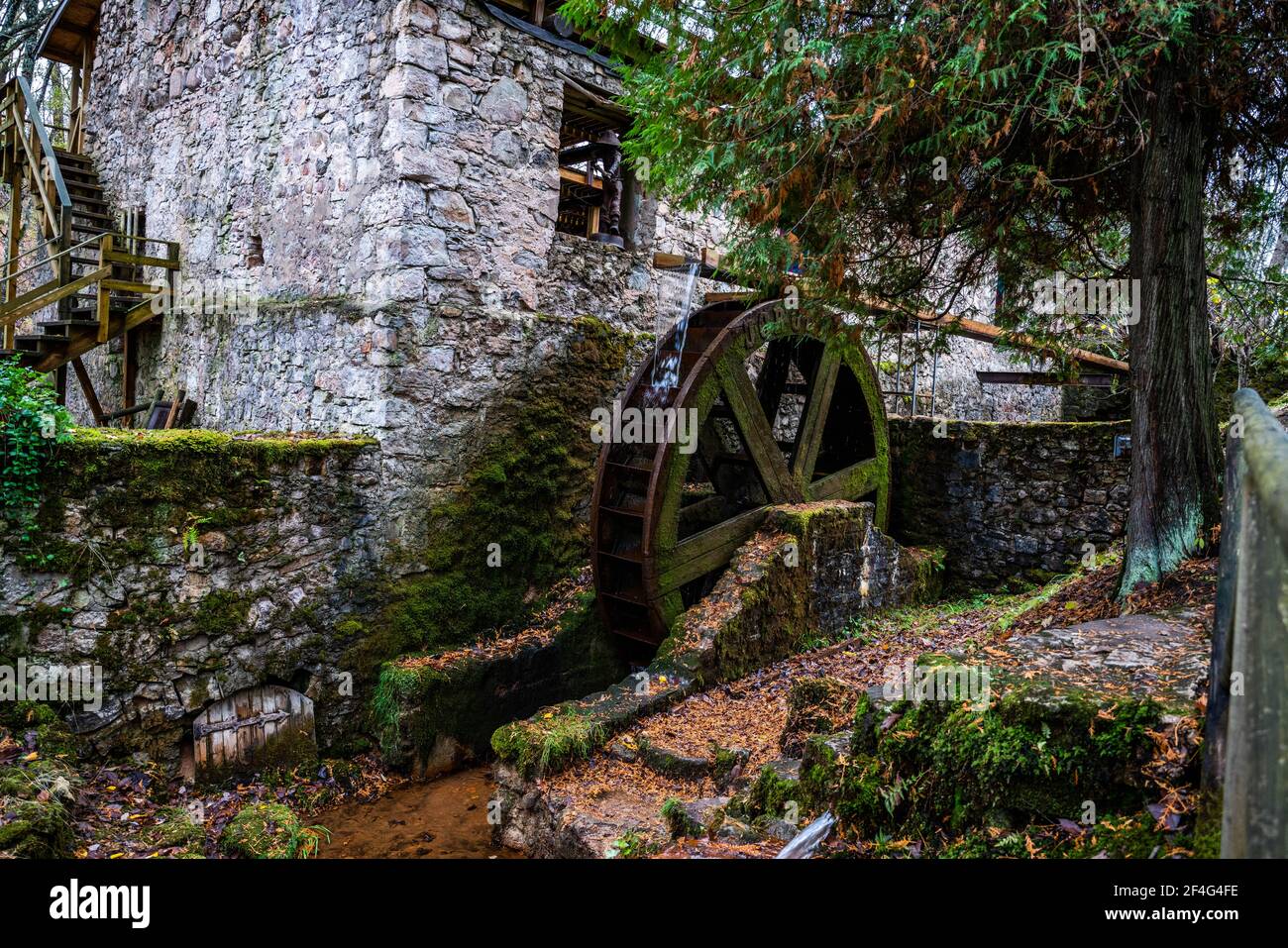 Waterfalls of Ieriku nature park at old watermill in the forest. It's a ...