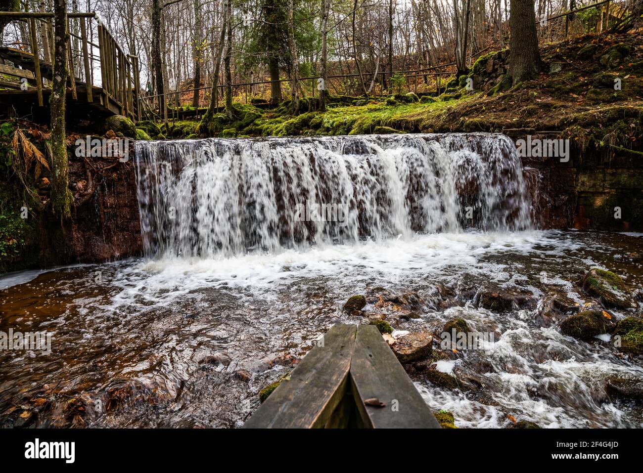 Waterfalls of Ieriku nature park at old watermill in the forest. It's a ...