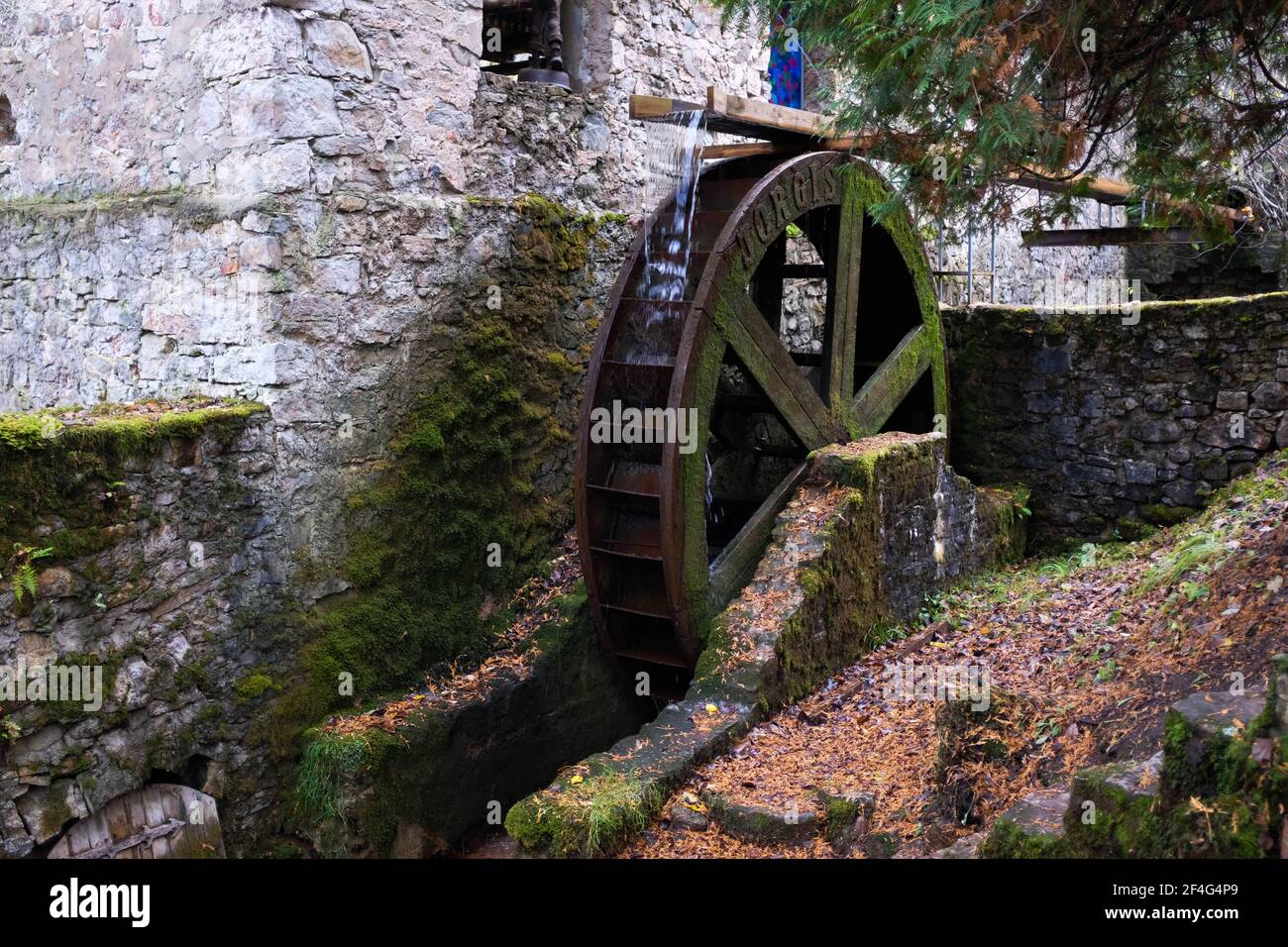 Waterfalls of Ieriku nature park at old watermill in the forest. It's a ...