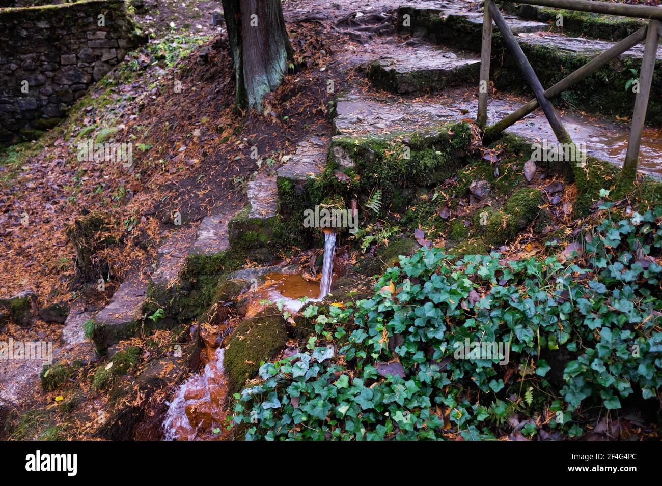 Waterfalls of Ieriku nature park at old watermill in the forest. It's a ...