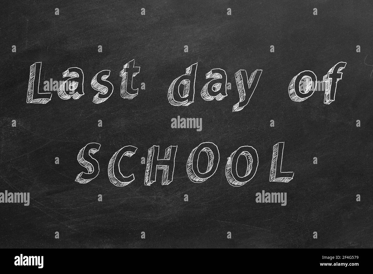 Hand drawing text "Last day of SCHOOL" on blackboard Stock Photo - Alamy