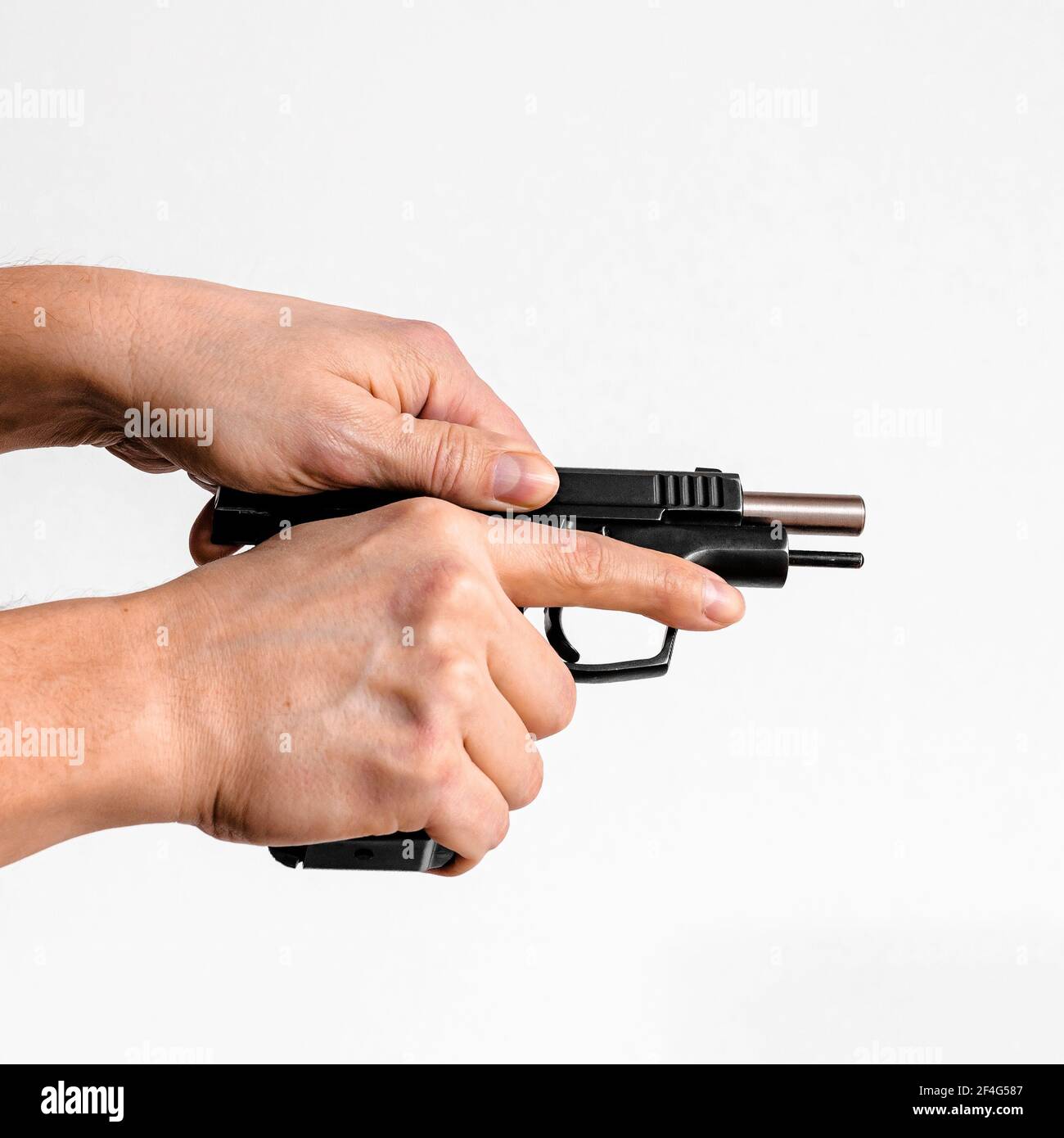 Man holding gun aiming pistol in hand ready to shoot. The criminal ...