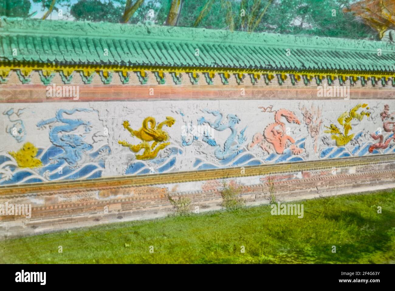 Angled view of the Nine-Dragon Wall, with carved and colorfully painted ...