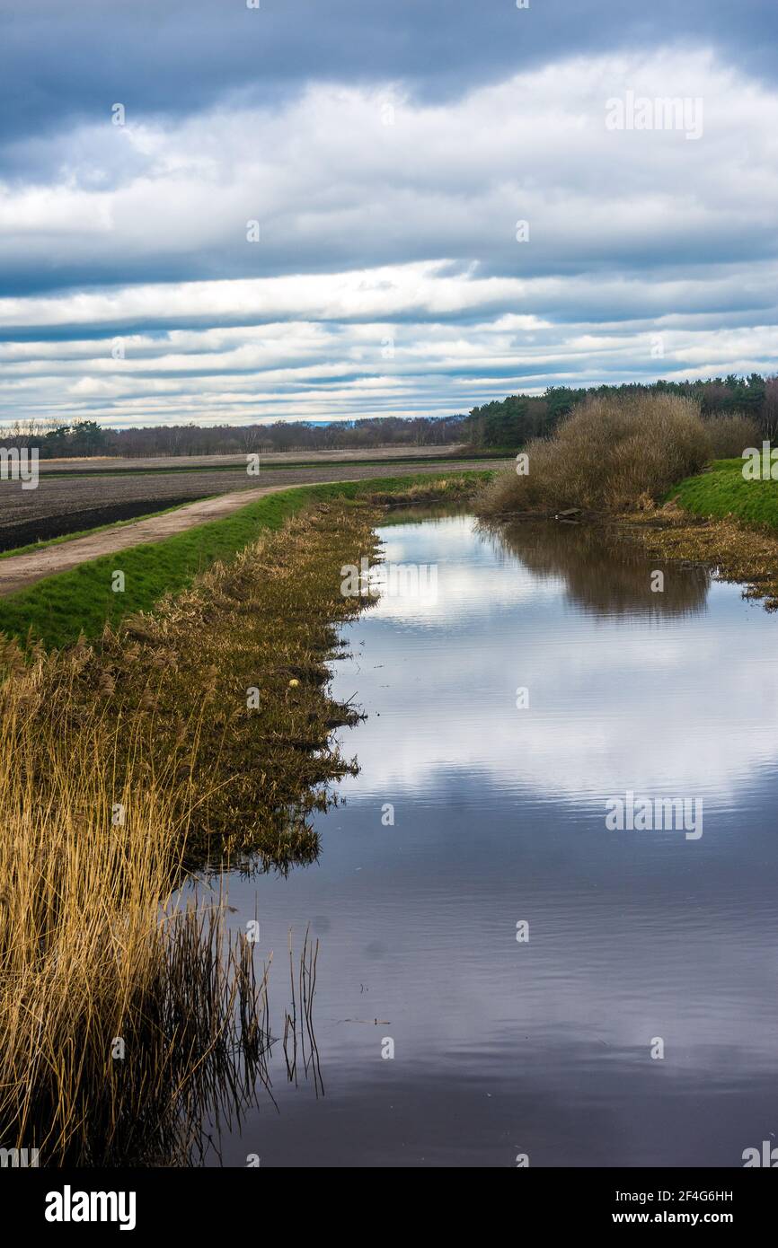 This waterway is wide and shallow and forms the boundary between Sefton ...