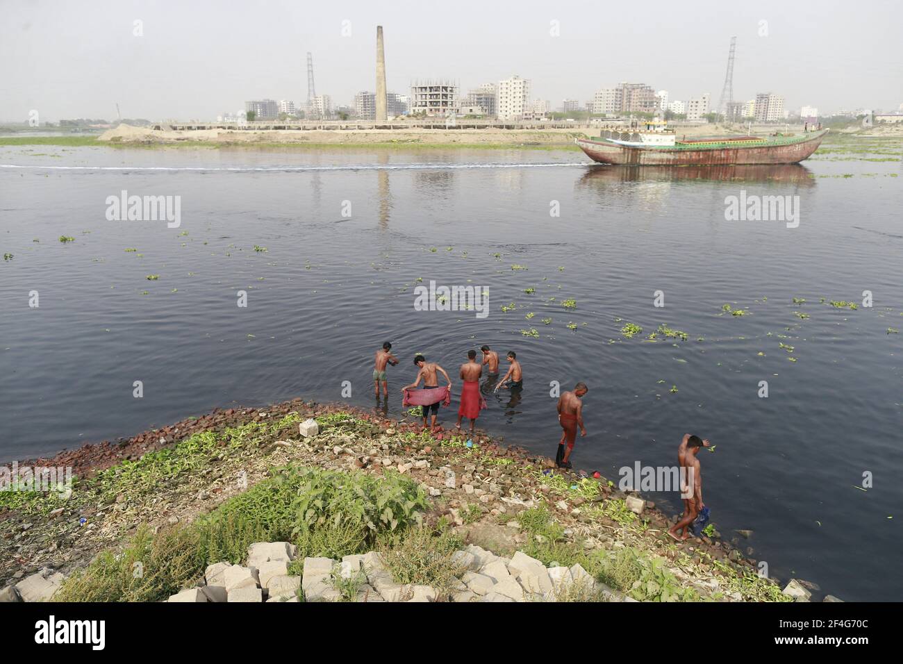 People take bath in the polluted Turag River in Savar, Bangladesh on ...