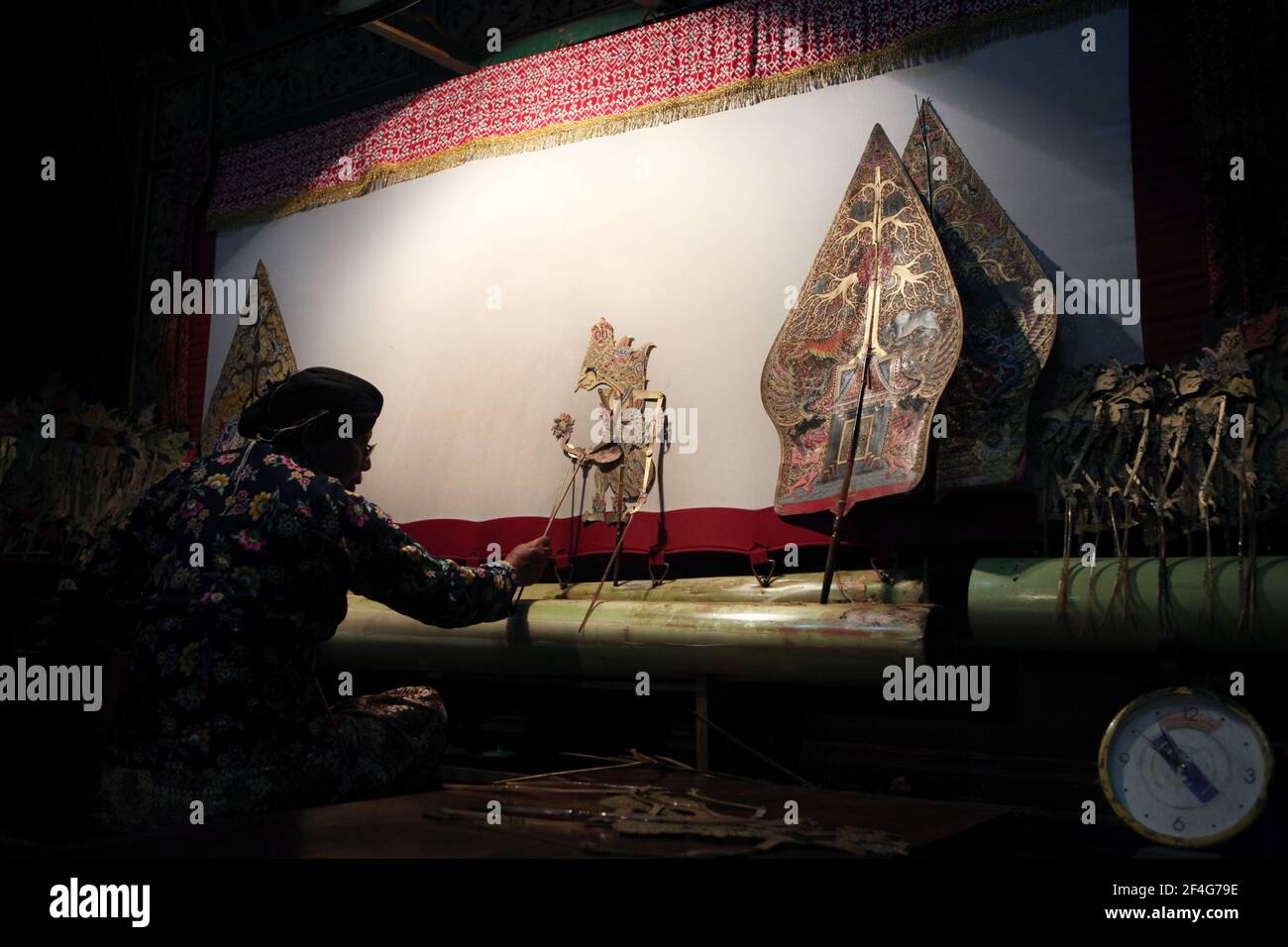 Puppet master (dalang) performs the wayang kulit performance 'The Death ...