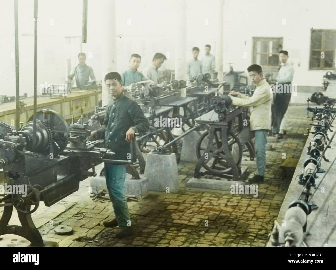 High-angle view of several men, some turned to face the camera ...