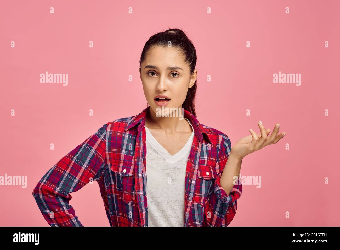 Surprised woman portrait, pink background, emotion Stock Photo - Alamy