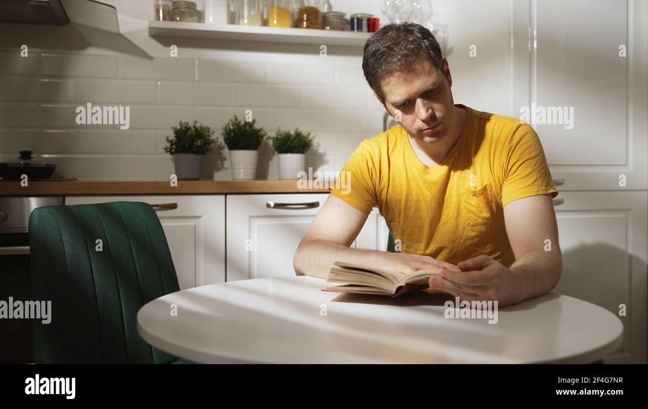 Man reading book early in the morning Stock Photo - Alamy