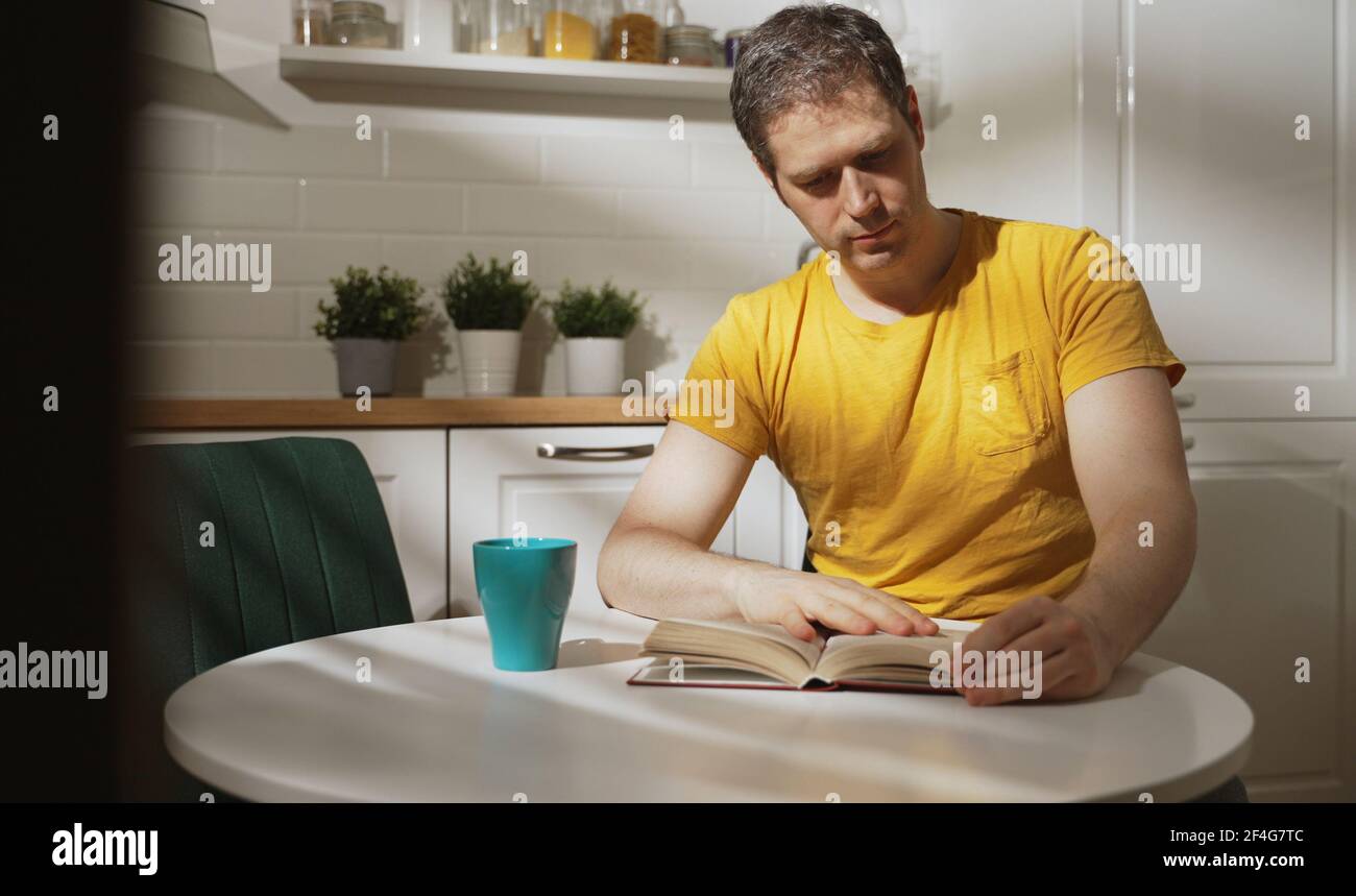 Man reading book early hi-res stock photography and images - Alamy