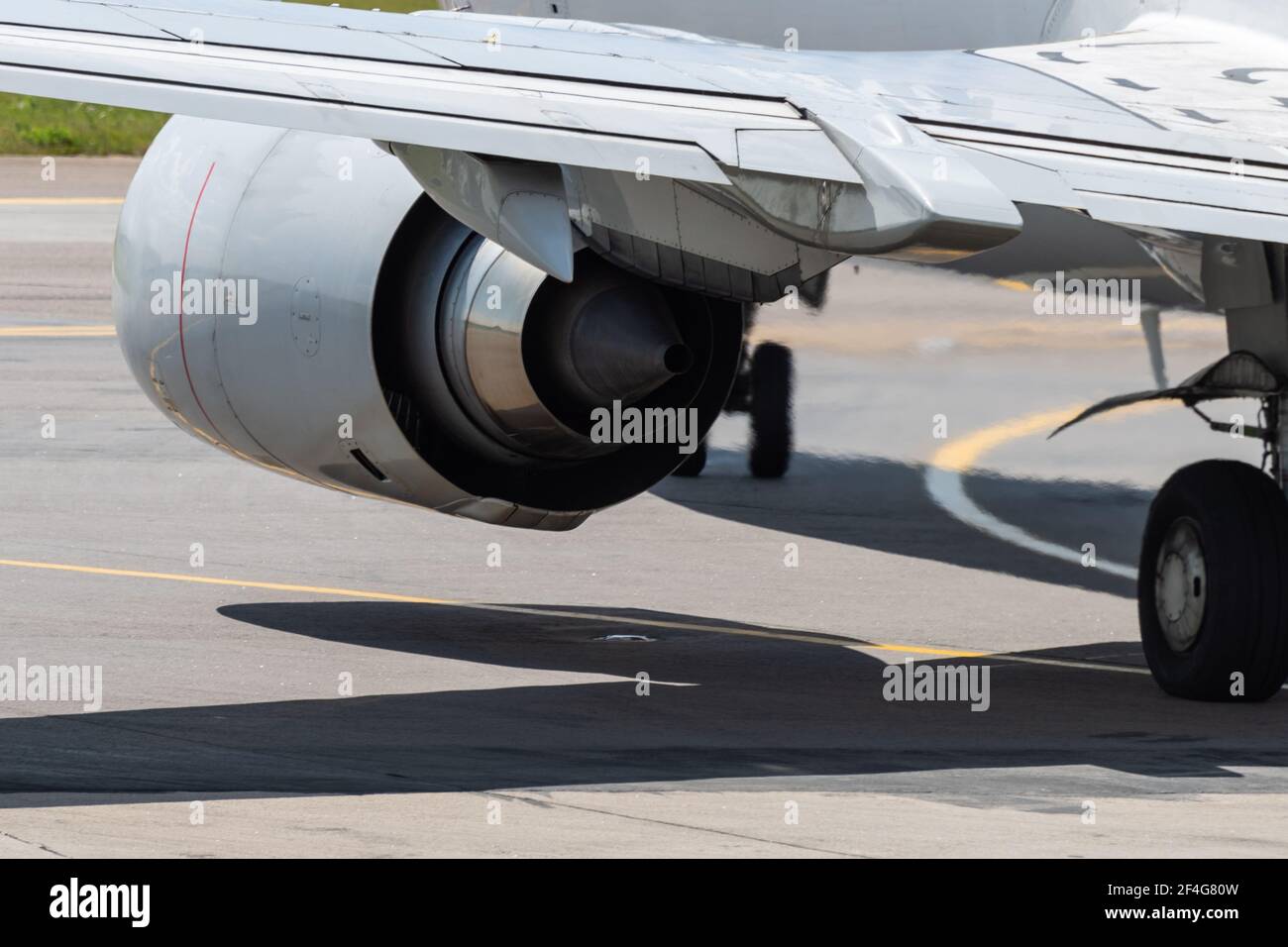Turbofan jet engine under the wing of a modern narrow-body passenger ...