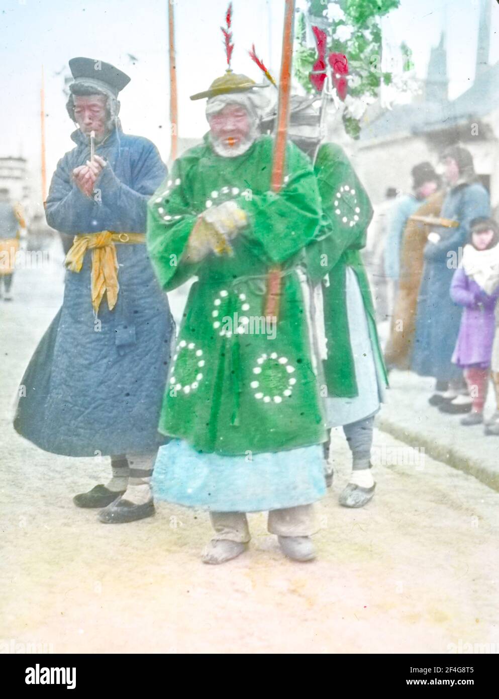 Hand-colored, Untitled lantern slide showing people in traditional ...