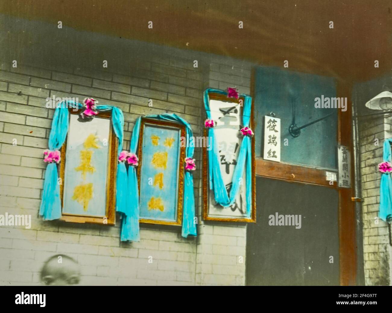 Hand-colored, Untitled lantern slide showing decorations outside a ...