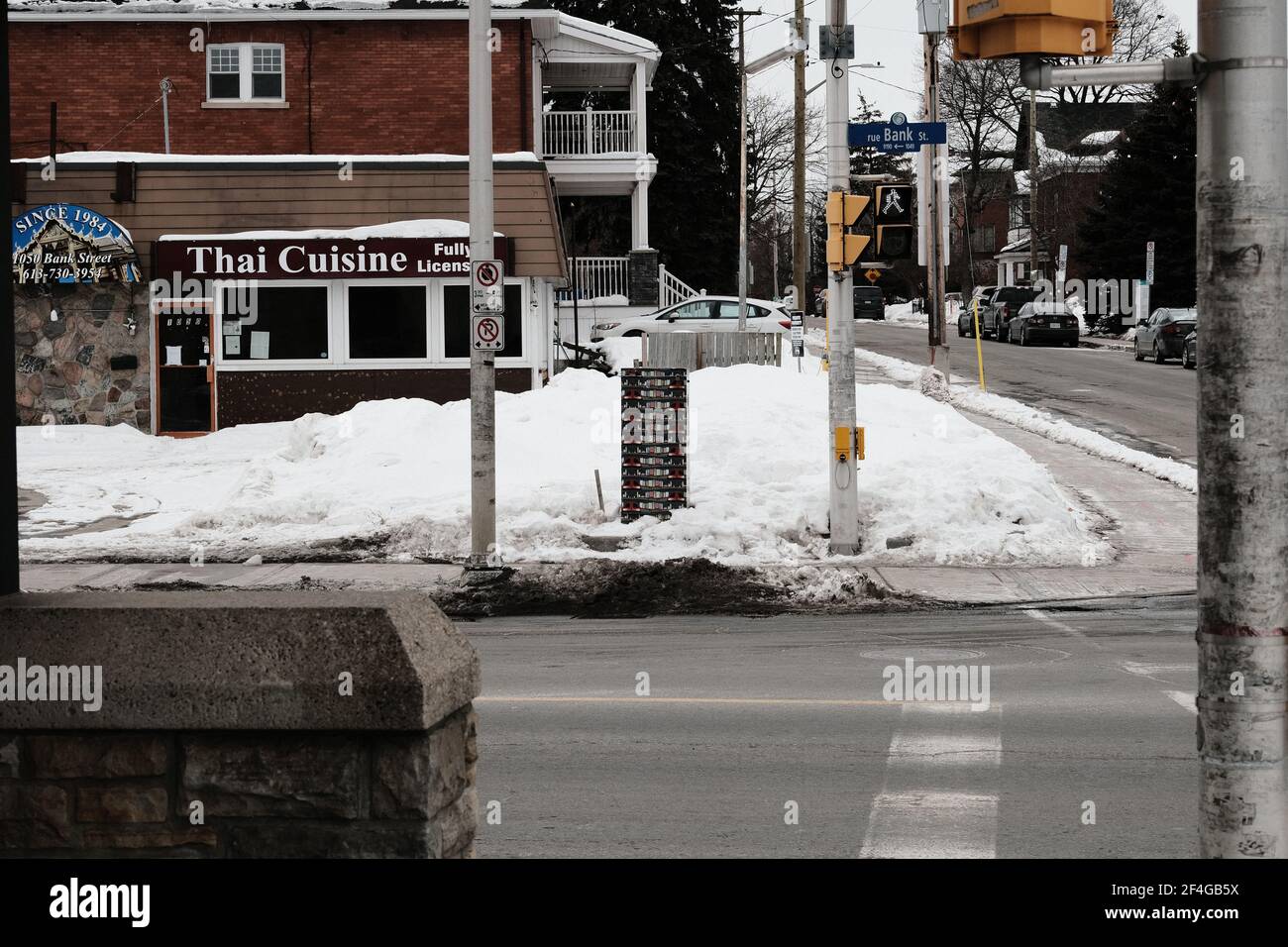 Grungy and snowy street scene at the corner of Bank and Aylmer opposite ...