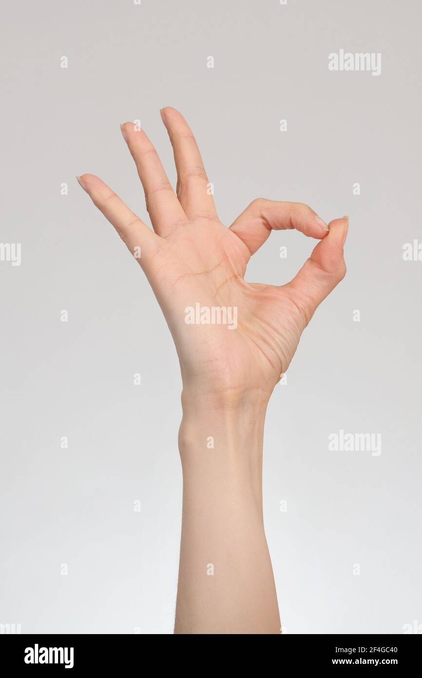 Ok hand gesture isolated on white background Stock Photo - Alamy