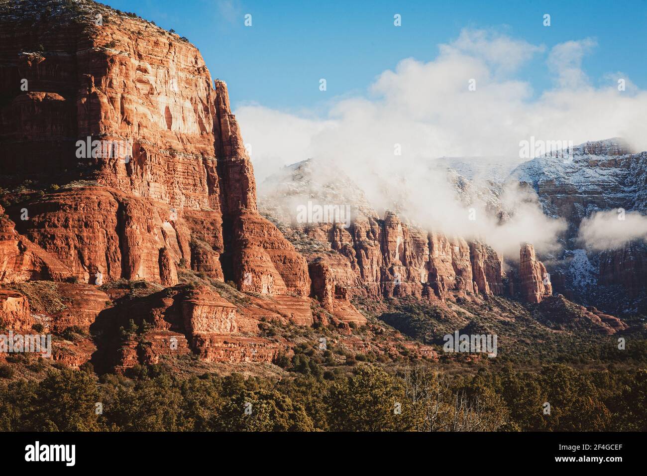 Courthouse rock and its neighbors are shrouded in low clouds following ...