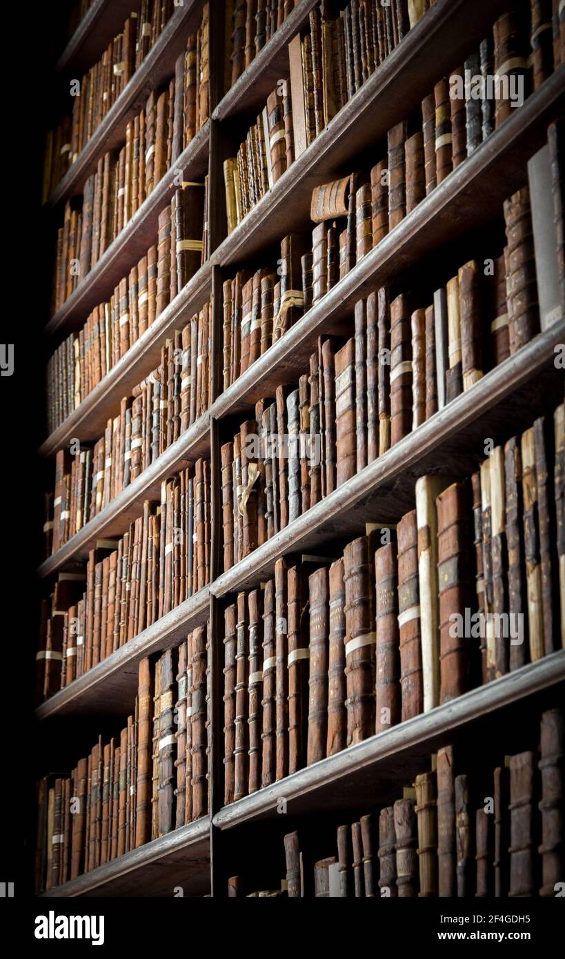 Vintage library with shelves of old books in the Long Room in the ...