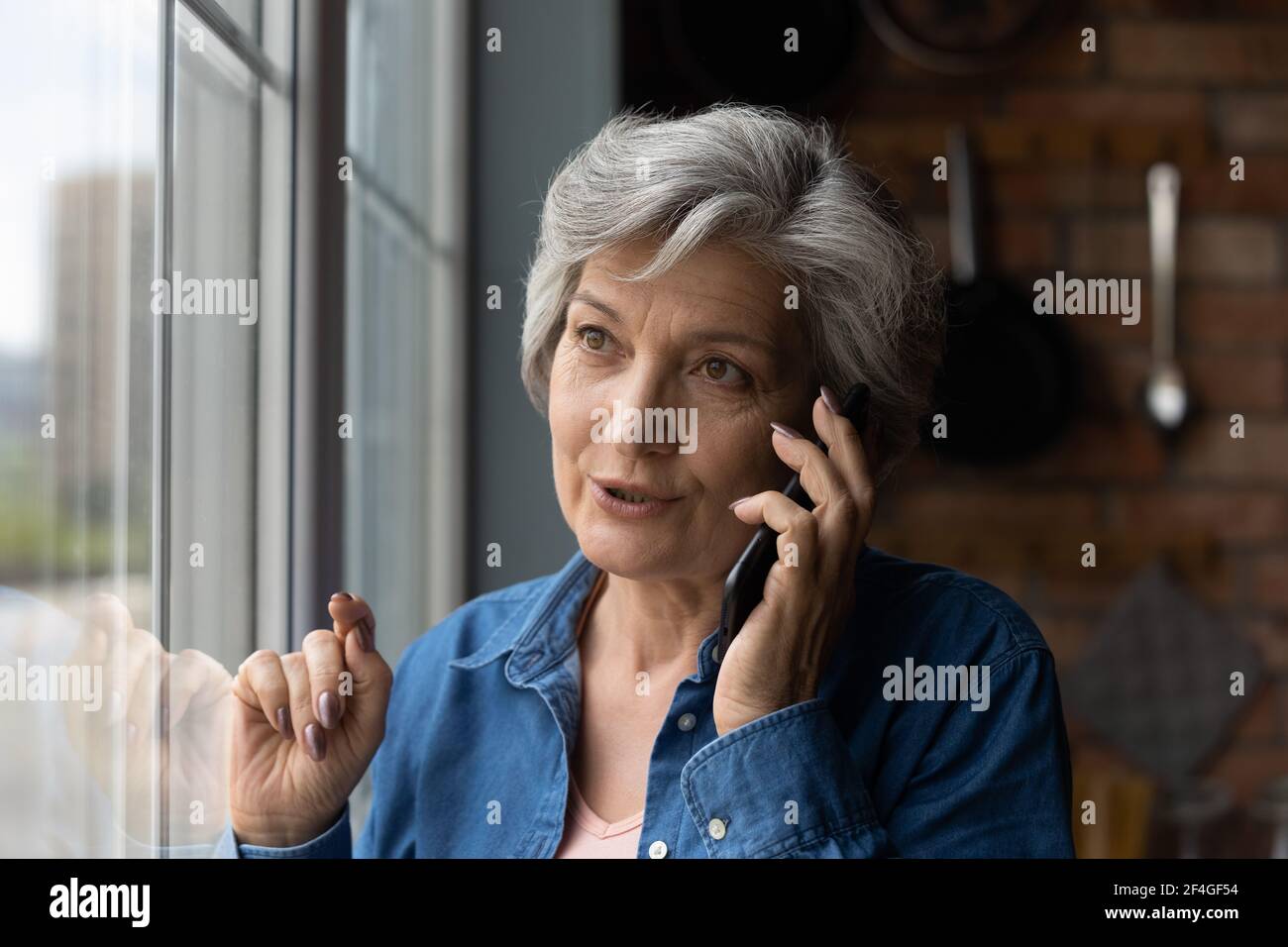 Woman engaged in phone call hi-res stock photography and images - Alamy