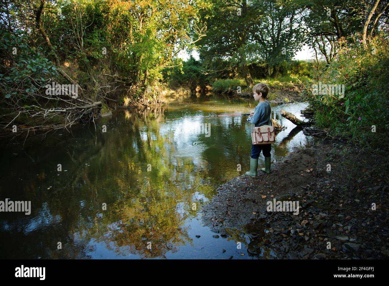 Boy fishing uk river hi-res stock photography and images - Alamy