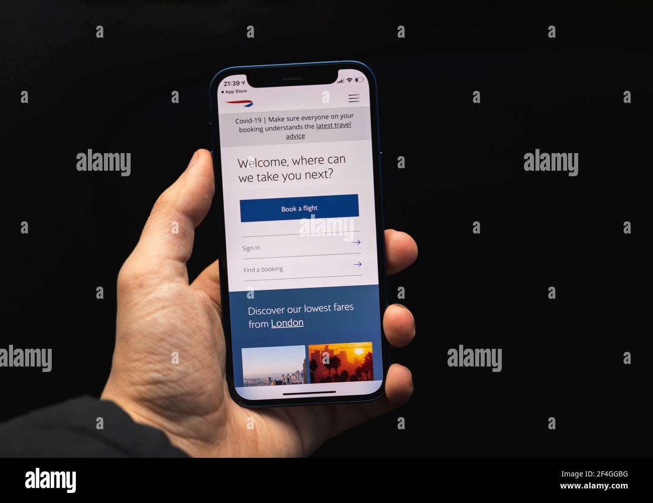 Kharkov, Ukraine - March 17, 2021: British Airways application, man ...