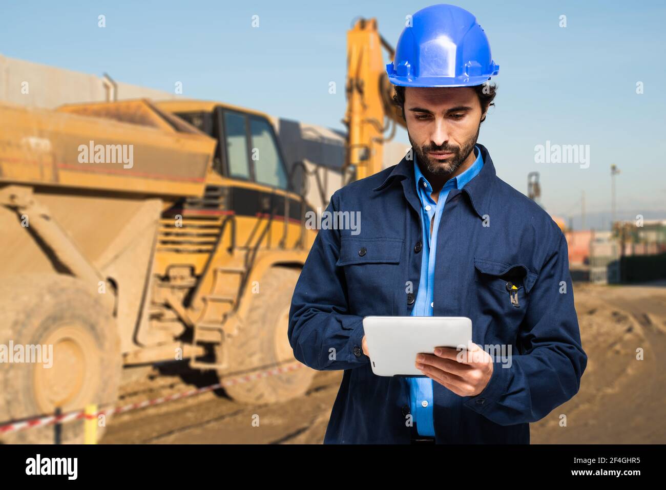 Construction specialist using tablet hi-res stock photography and ...