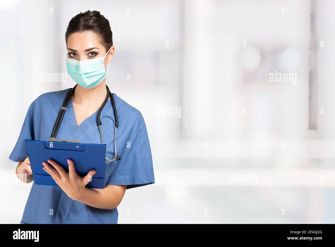 Portrait of a young masked nurse in an hospital Stock Photo - Alamy
