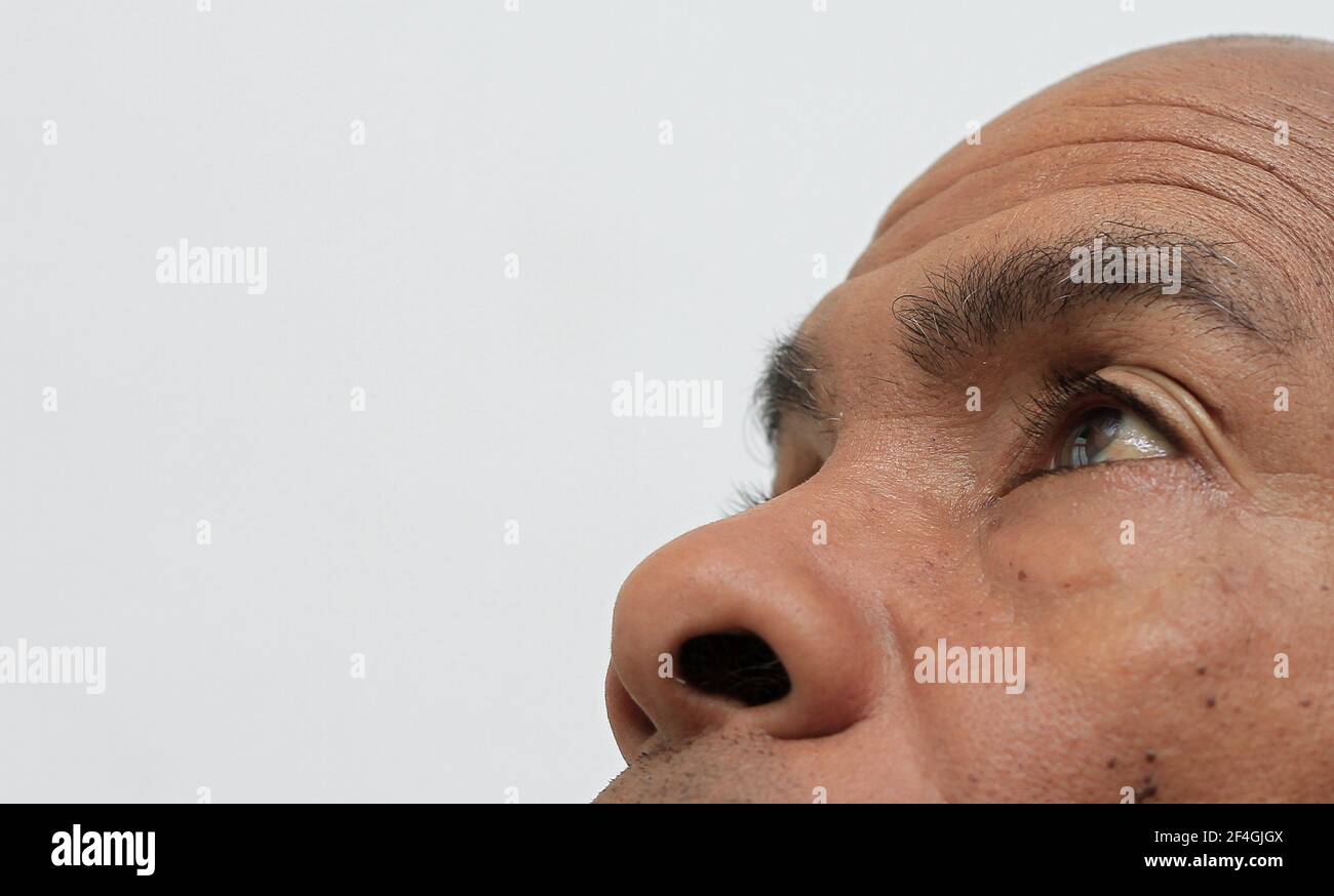 man praying to god with eyes open Caribbean man praying with white ...