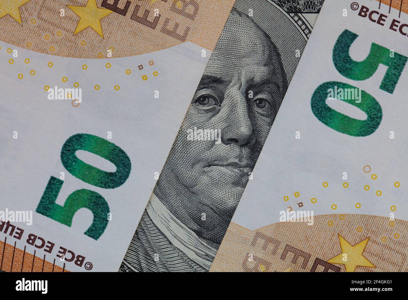 Benjamin Franklin peeking through 50 euro banknotes for design purpose ...