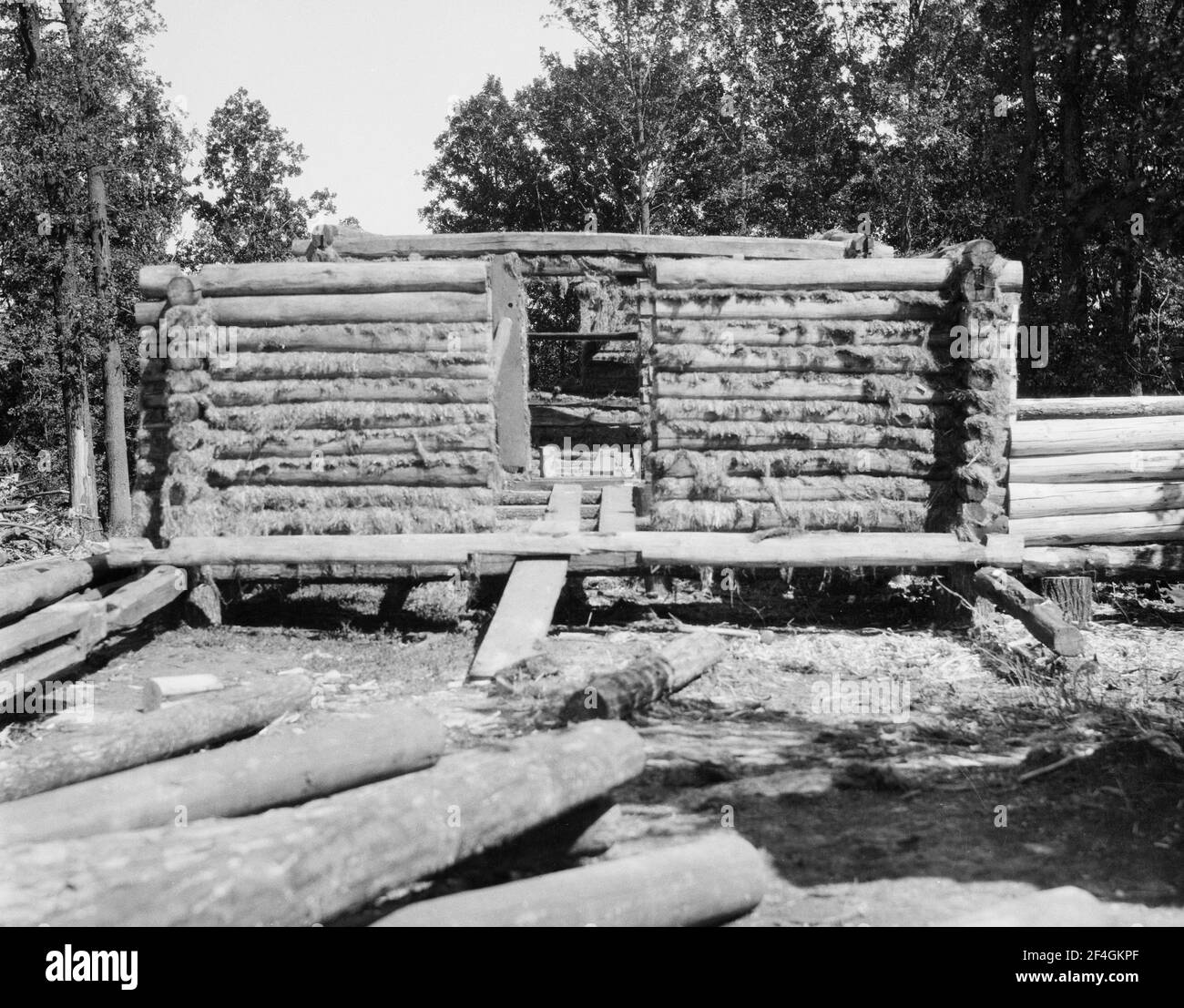 Log cabin, half-built, Russia,1931. From the Sidney D. Gamble ...