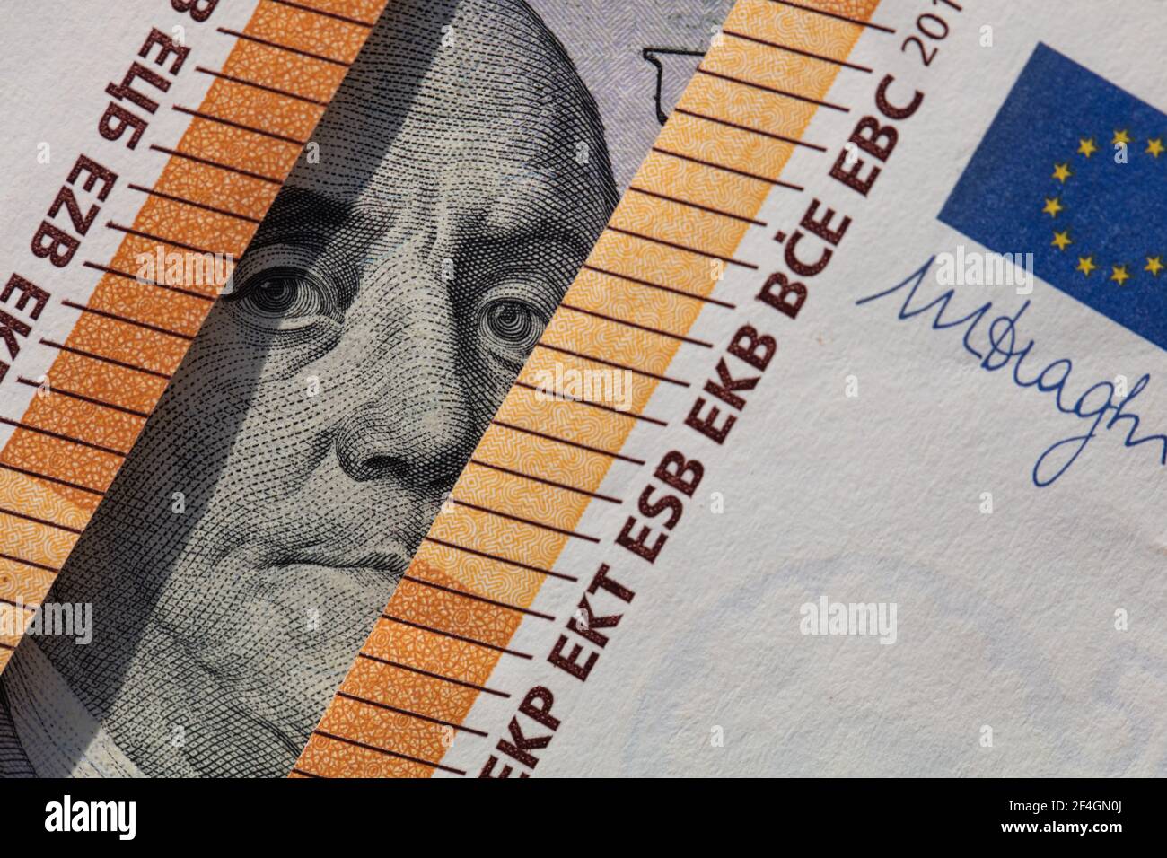 Benjamin Franklin peeking through 50 euro banknotes for design purpose ...