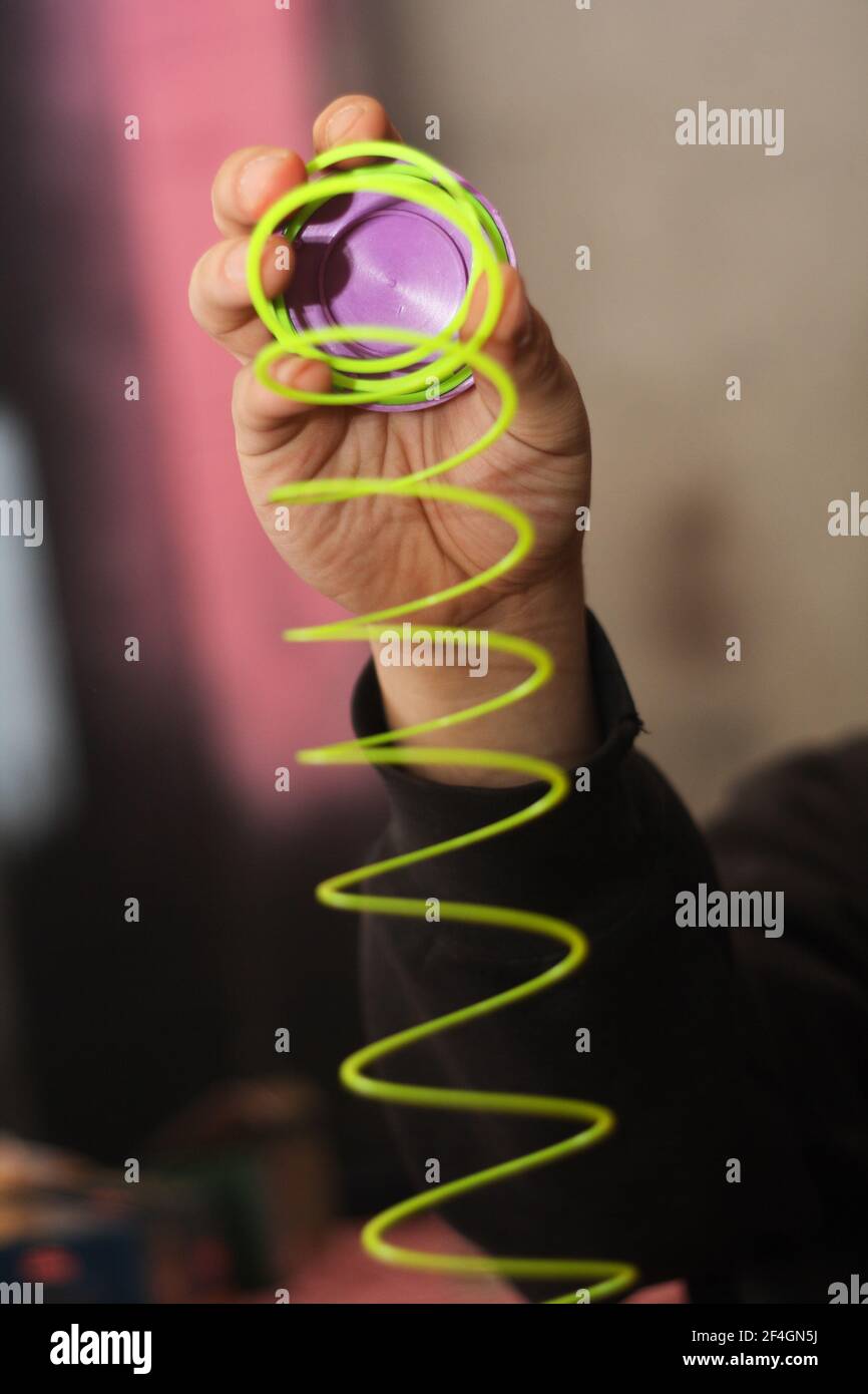 Slinky toy hand hi-res stock photography and images - Alamy