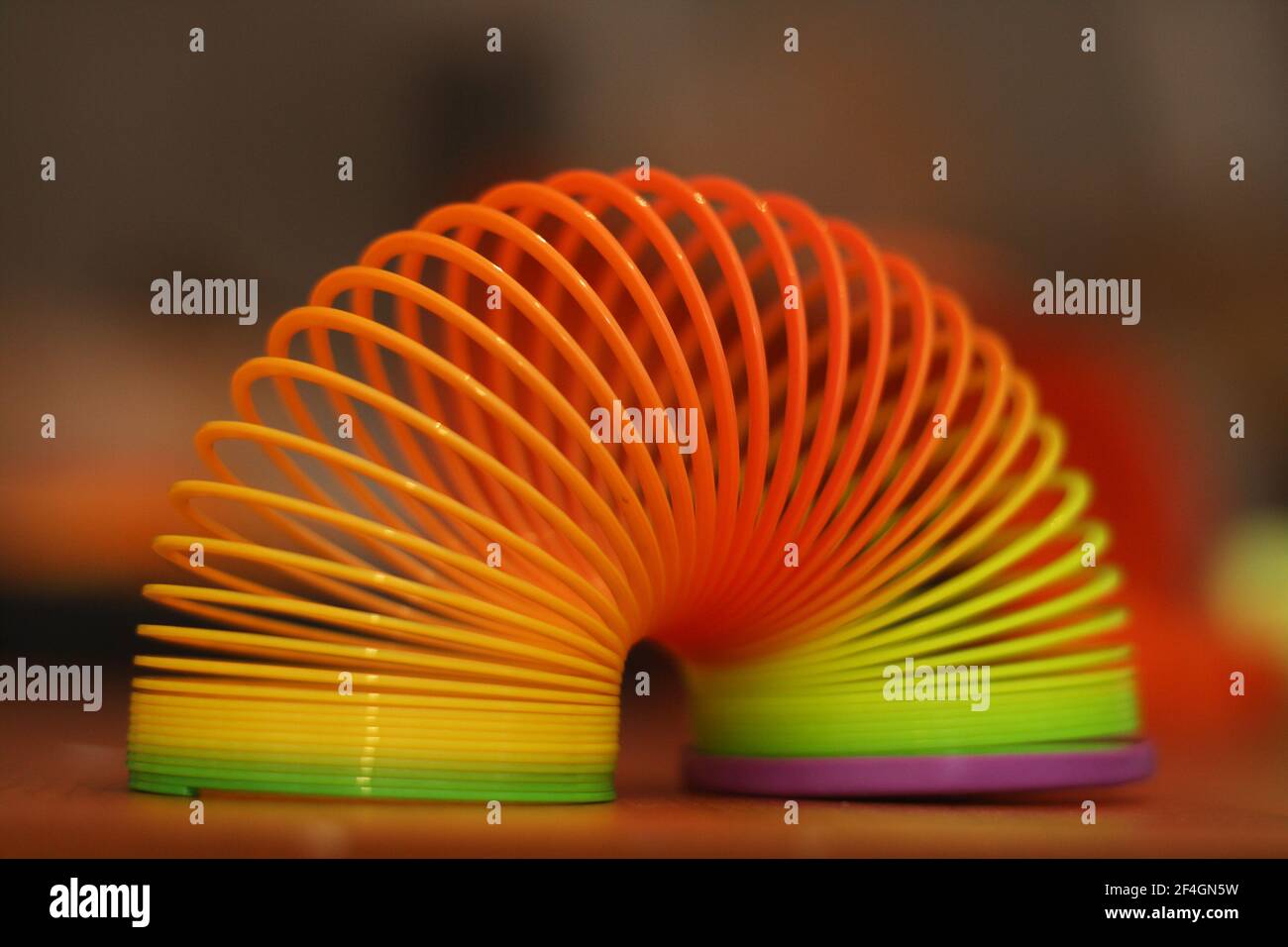 bright color slinky toy closeup Stock Photo - Alamy