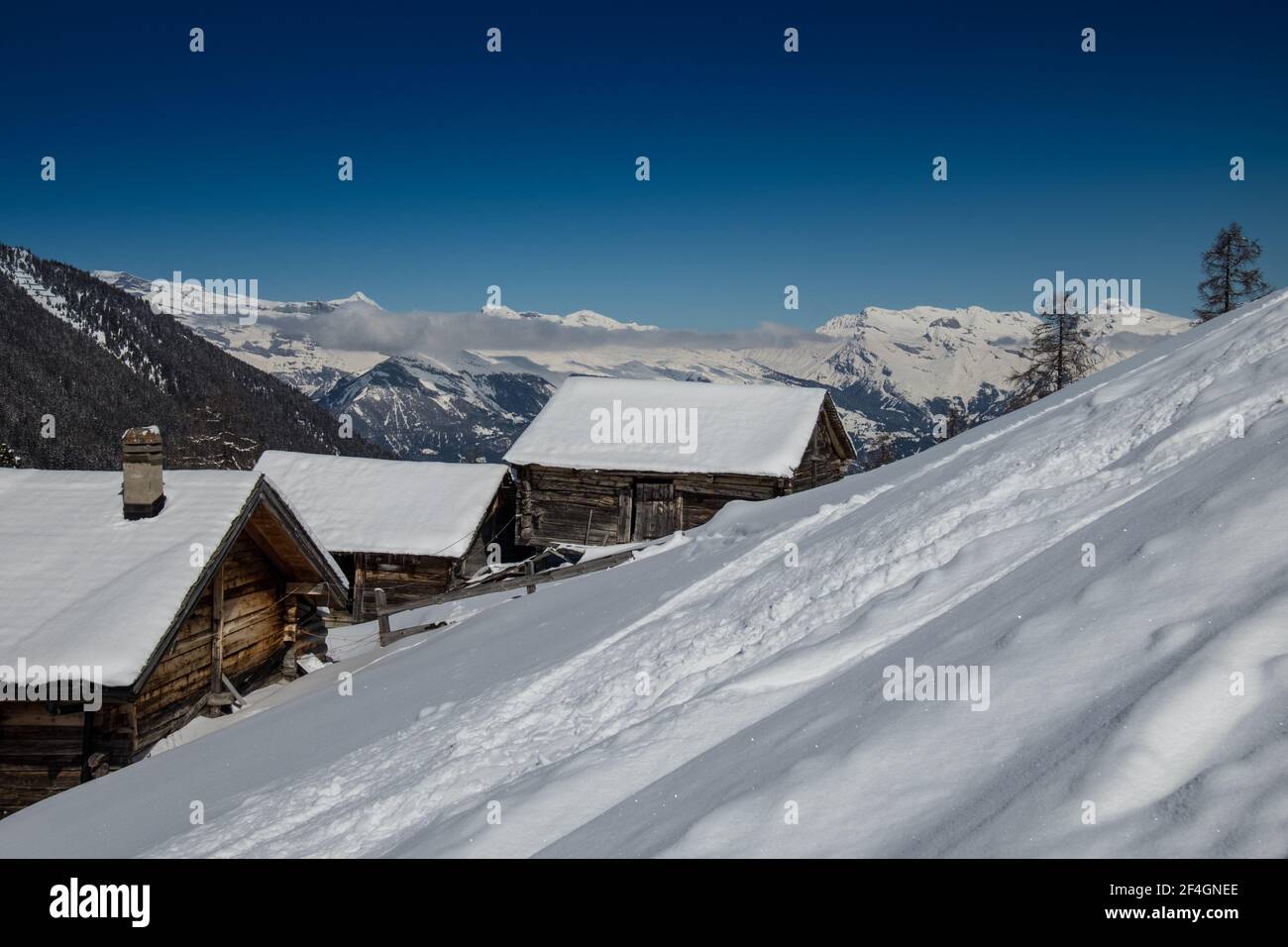 Landscape view of a typical mountain village, with chalets covered by ...