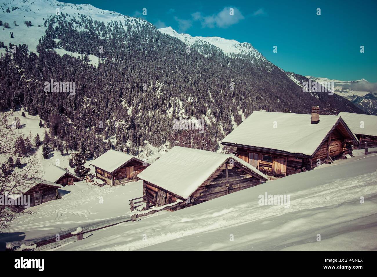 Landscape view of a typical mountain village, with chalets covered by ...