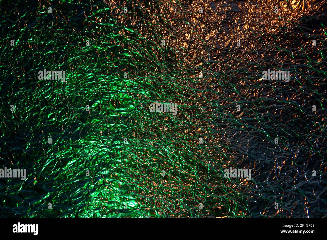 Abstract gold and green aluminum wrinkled foil background texture ...
