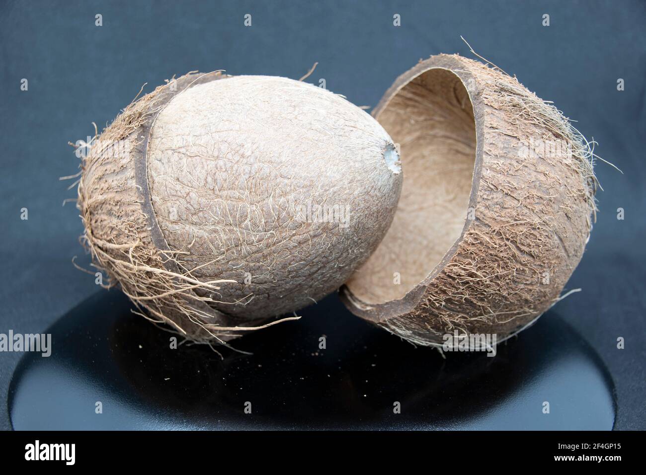 Cracked coconut with pulp on a gray background.Coconut close-up Stock ...