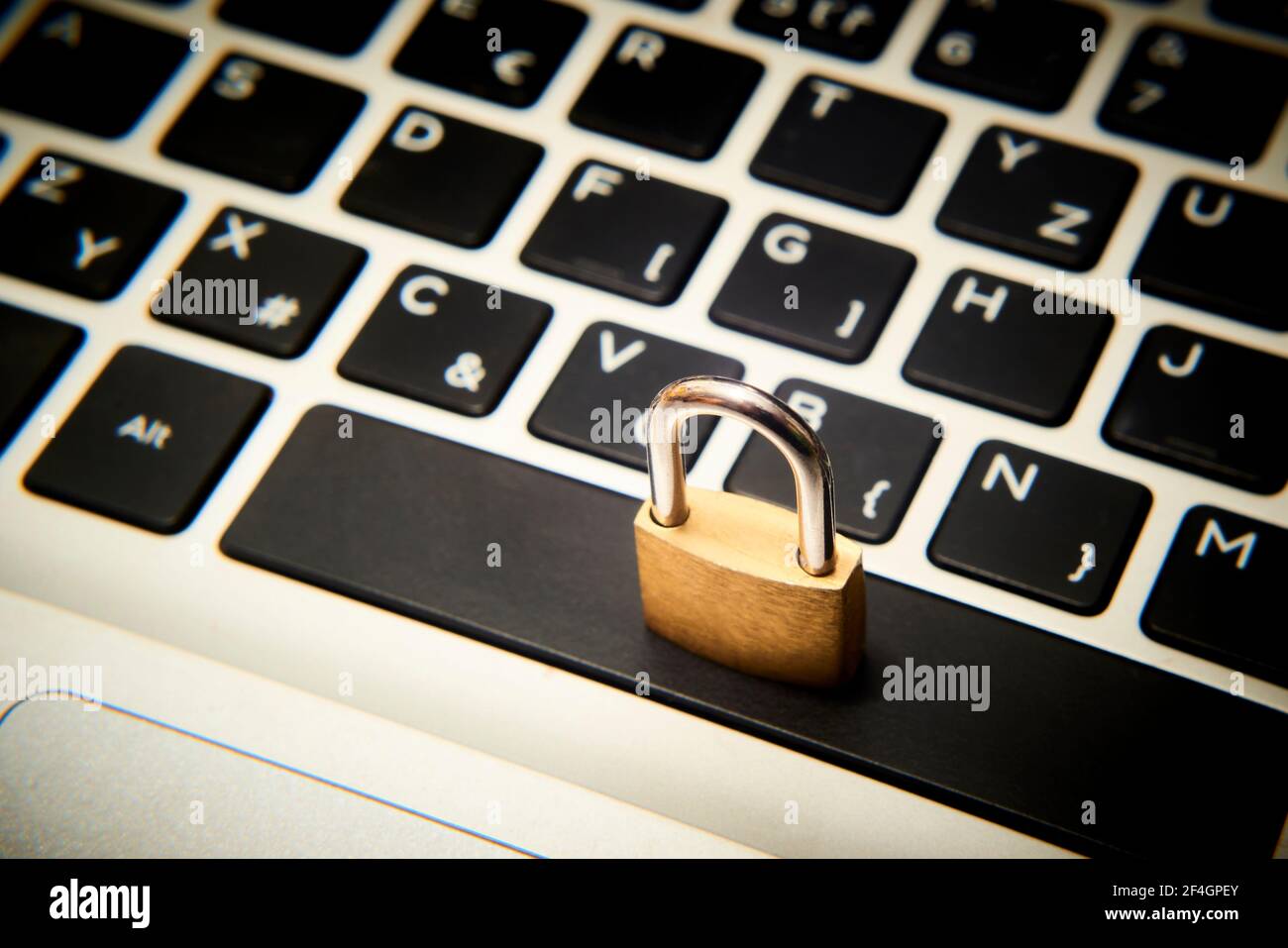 Computer security concept. Unlocked padlock on notebook keyboard ...