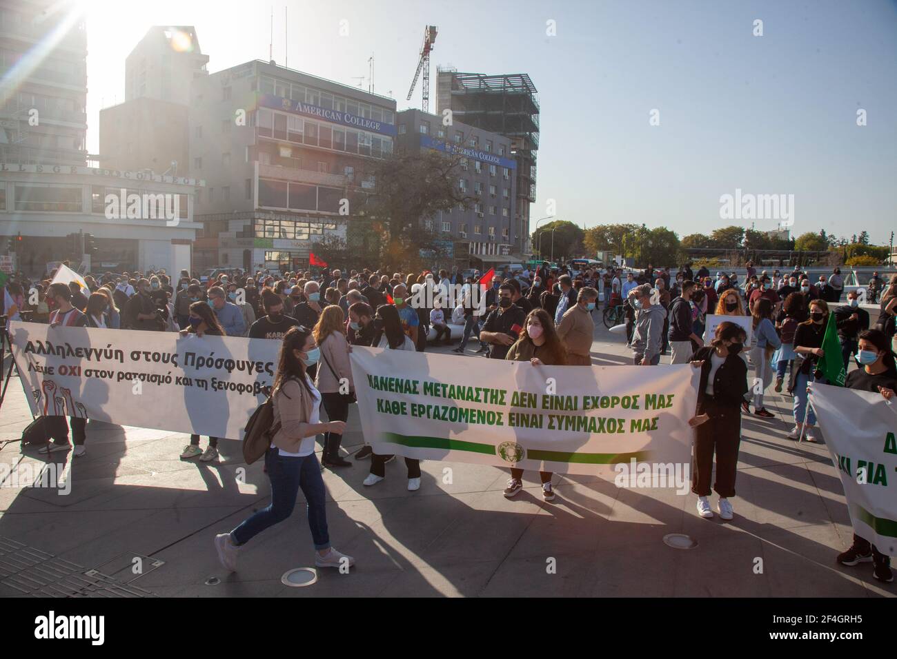 Protesters hold a large banner during a protest march on March 21 ...