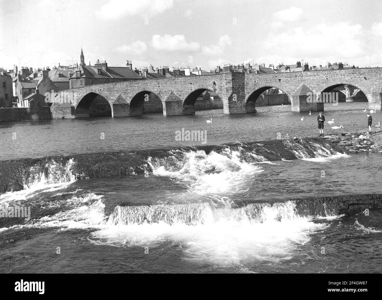 1951, historical, view down the river Nith of Devorgilla bridge, an ...